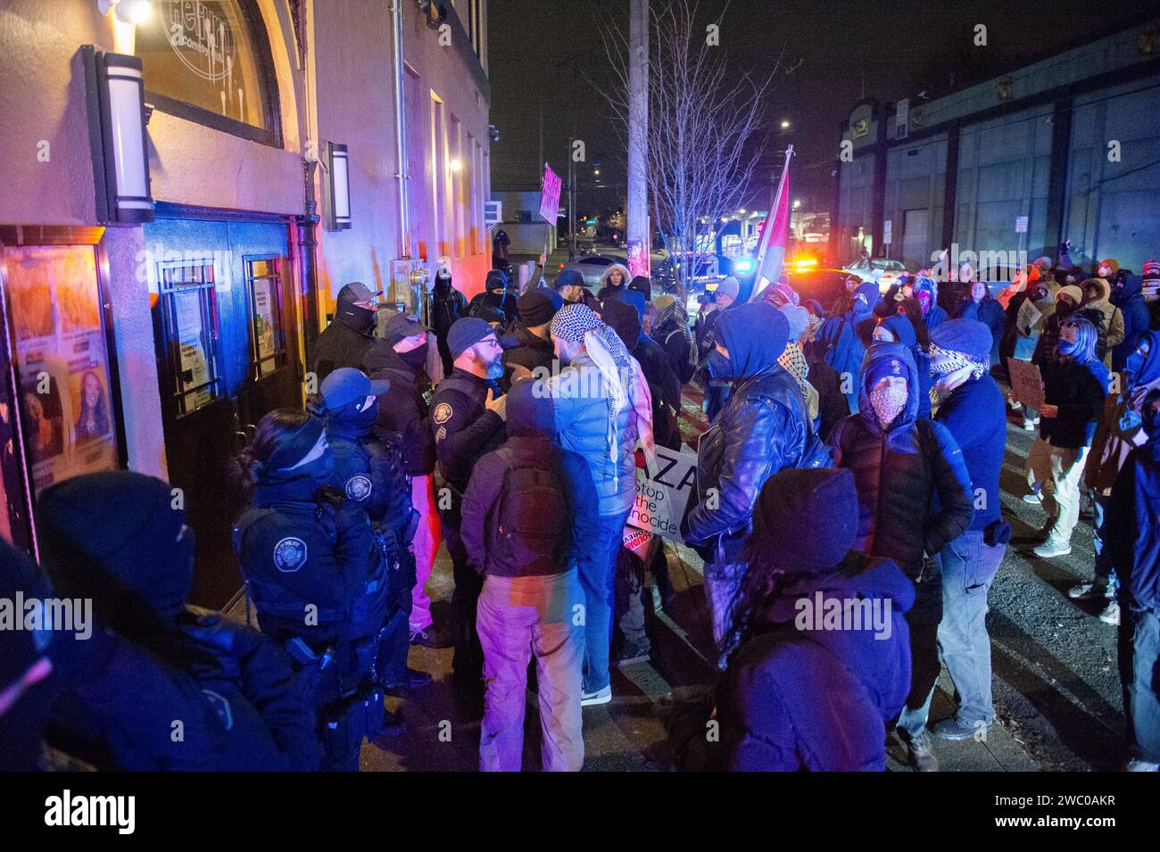Portland, Oregon, USA. 12th Jan, 2024. Portland Police hold a line in ...