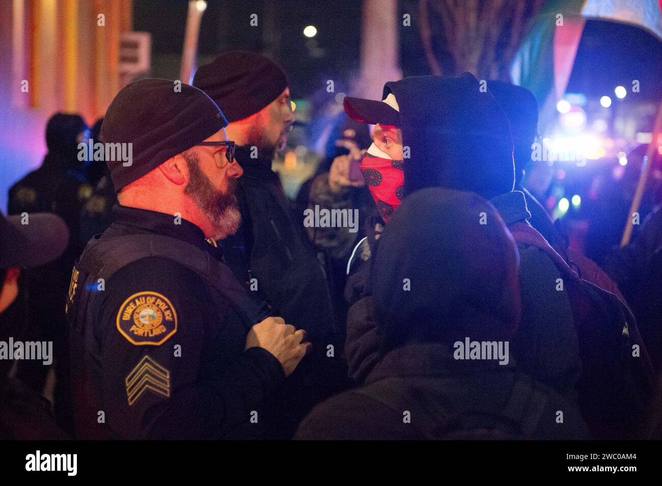 Portland, Oregon, USA. 12th Jan, 2024. Portland Police hold a line in ...