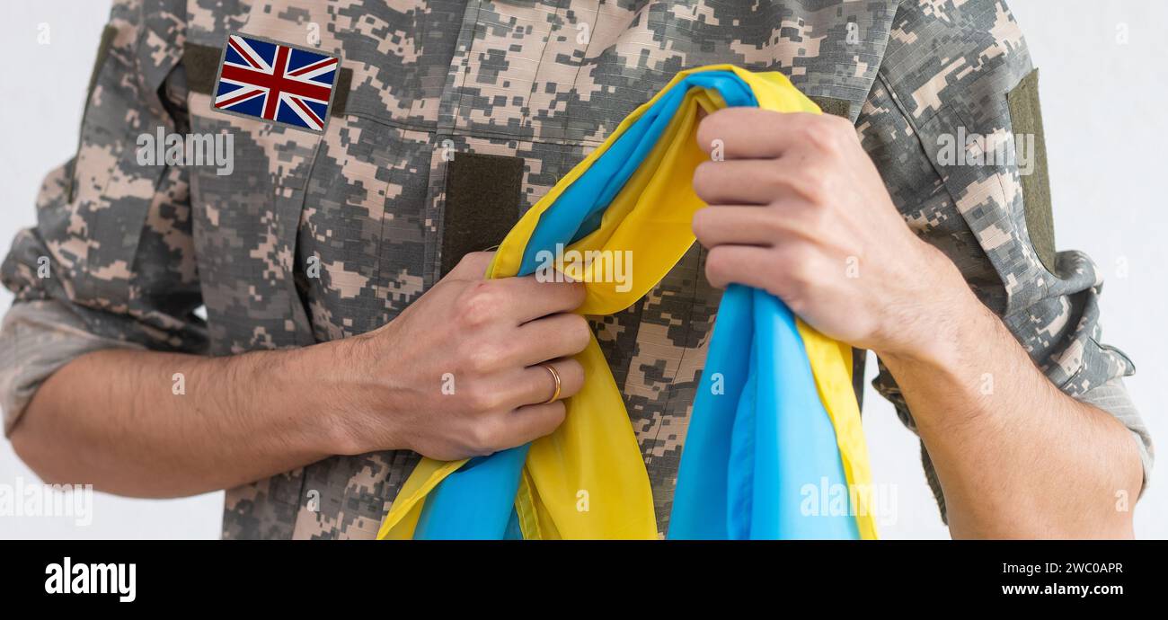 British soldier with Ukrainian flag Stock Photo - Alamy