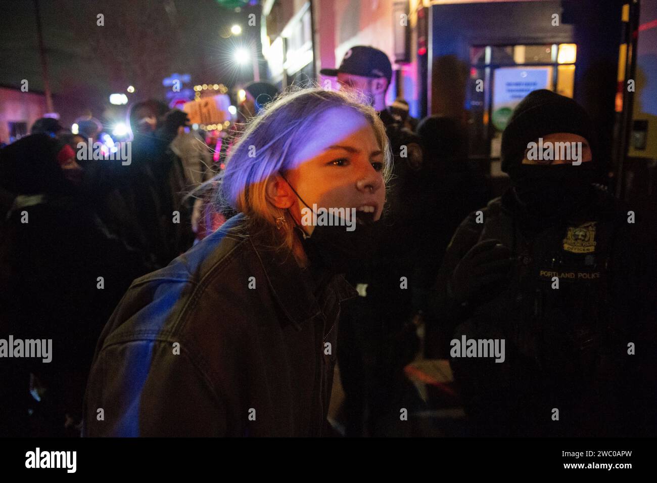 Portland, Oregon, USA. 12th Jan, 2024. Portland Police hold a line in ...