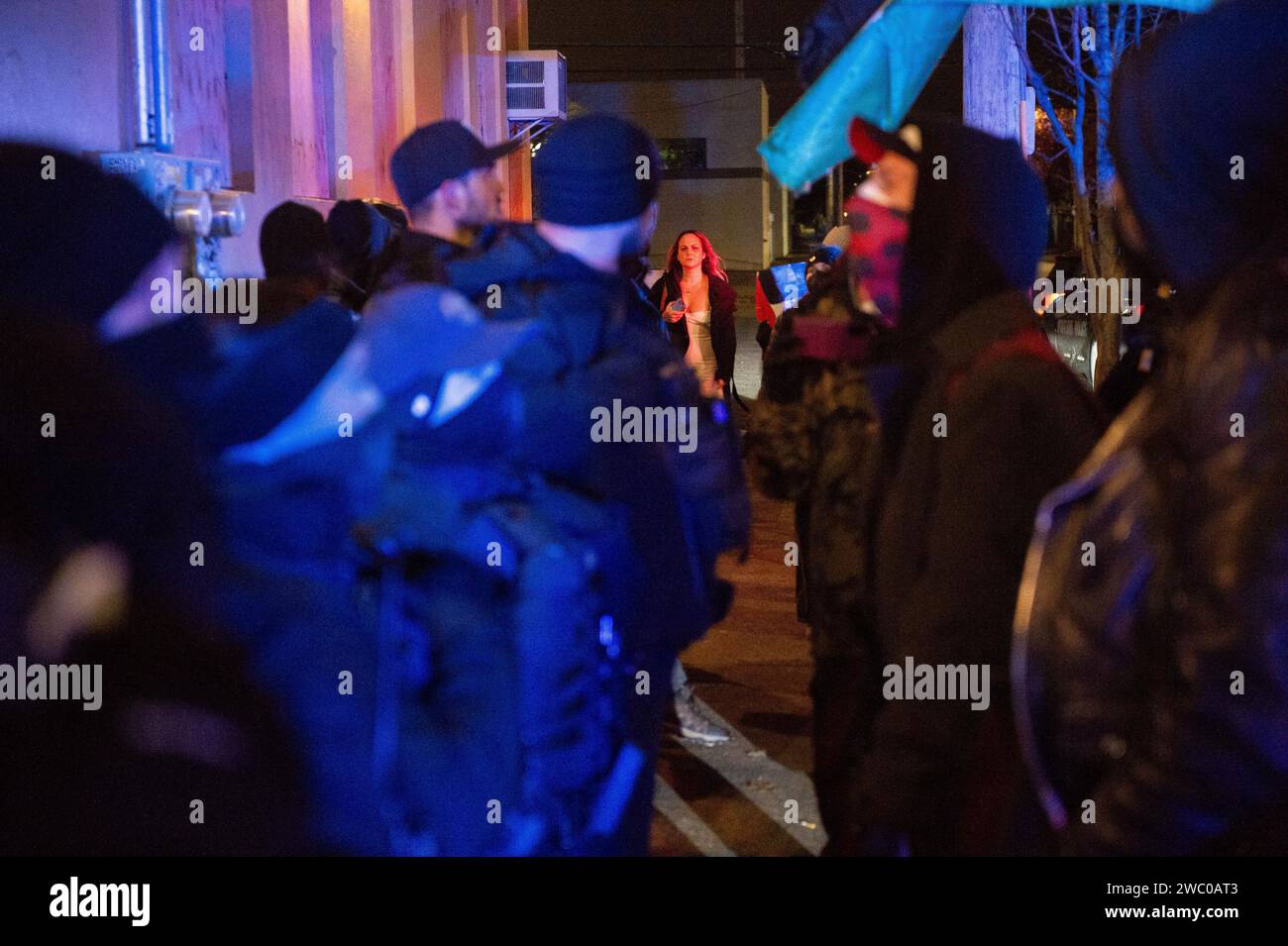 Portland, Oregon, USA. 12th Jan, 2024. Portland Police hold a line in ...
