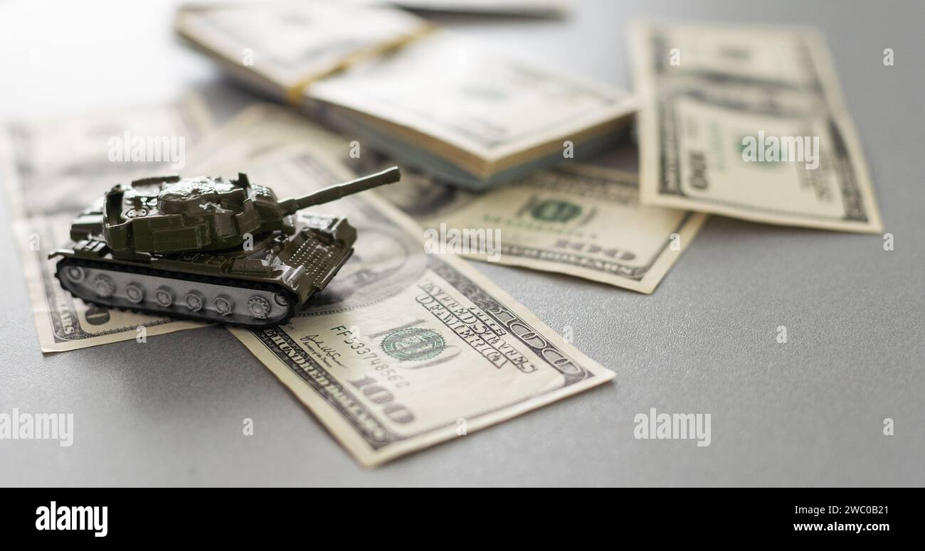 Tank on dollar bills. The concept of war costs, military spending Stock ...