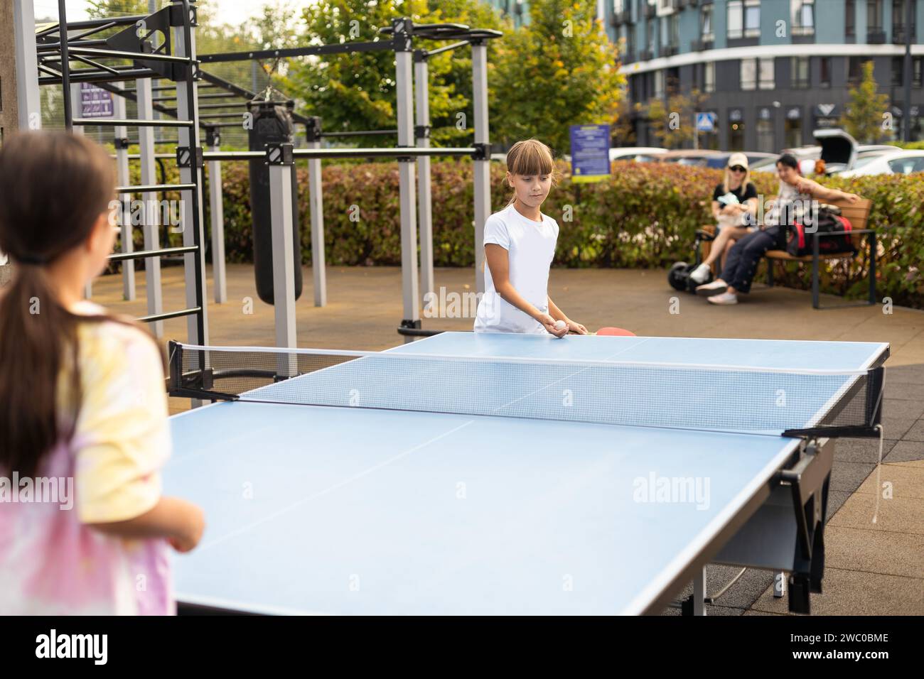 Little children playing ping pong in park Stock Photo - Alamy