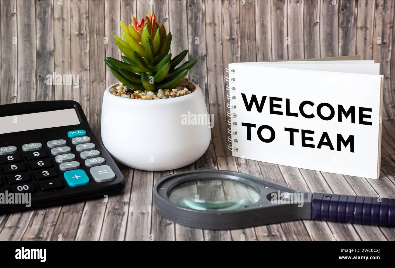 WELCOME TO TEAM text concept write on notebook with office tools on ...