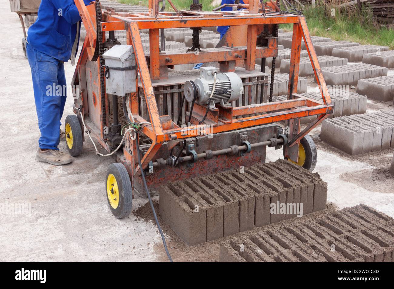 african man brick manufacturing machine , made from cement concrete and ...