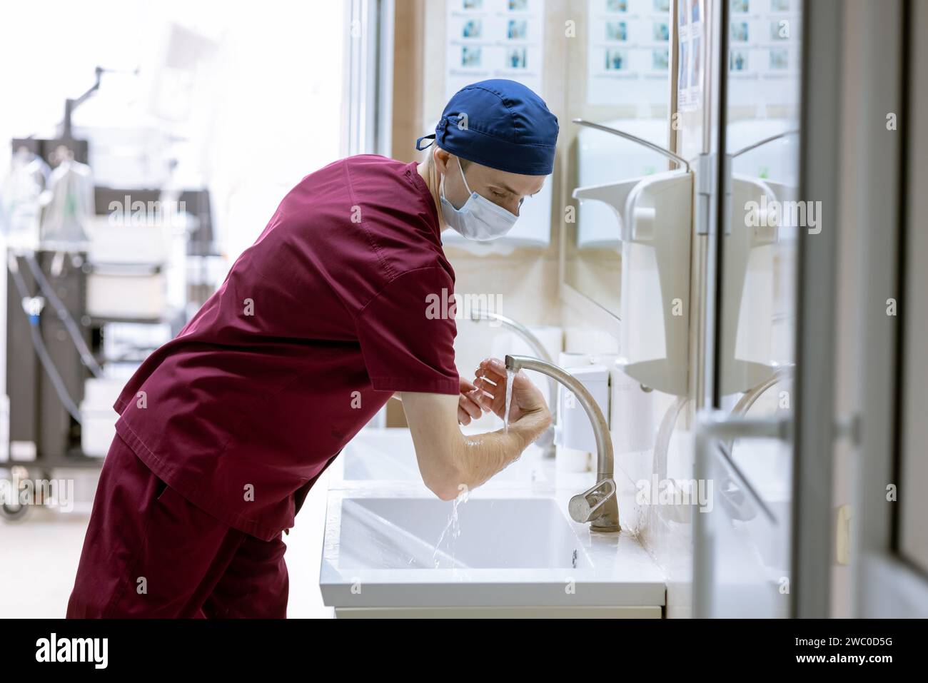 male surgeon washes his hands before surgery, doctor's sterile hands ...