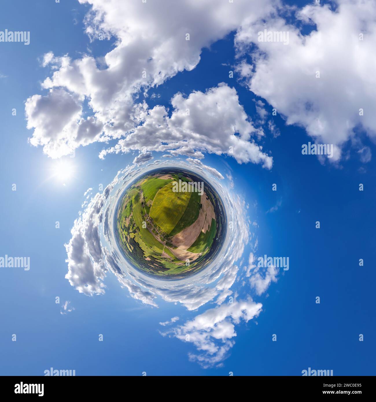 simple tiny planet without buildings in blue sky with beautiful clouds ...