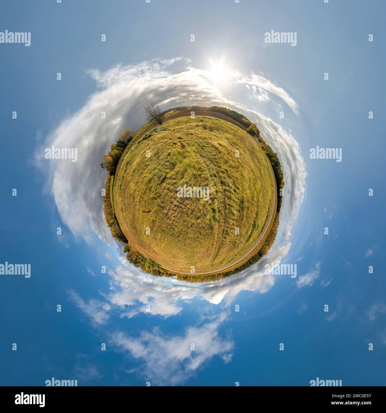 simple tiny planet without buildings in blue sky with beautiful clouds ...