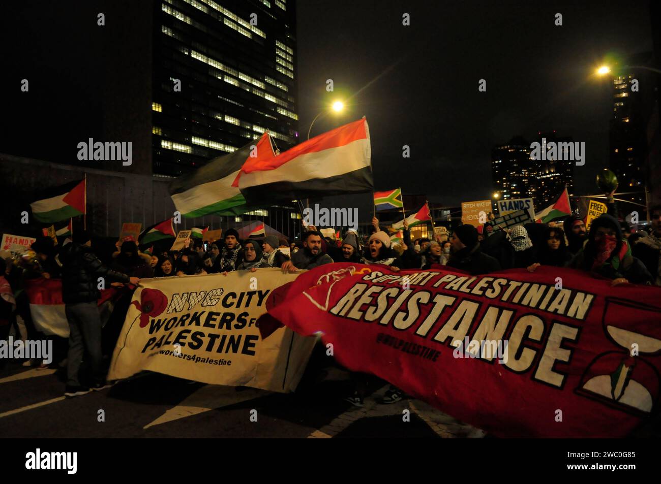 Protestors march in front of the United Nations building as they hold ...