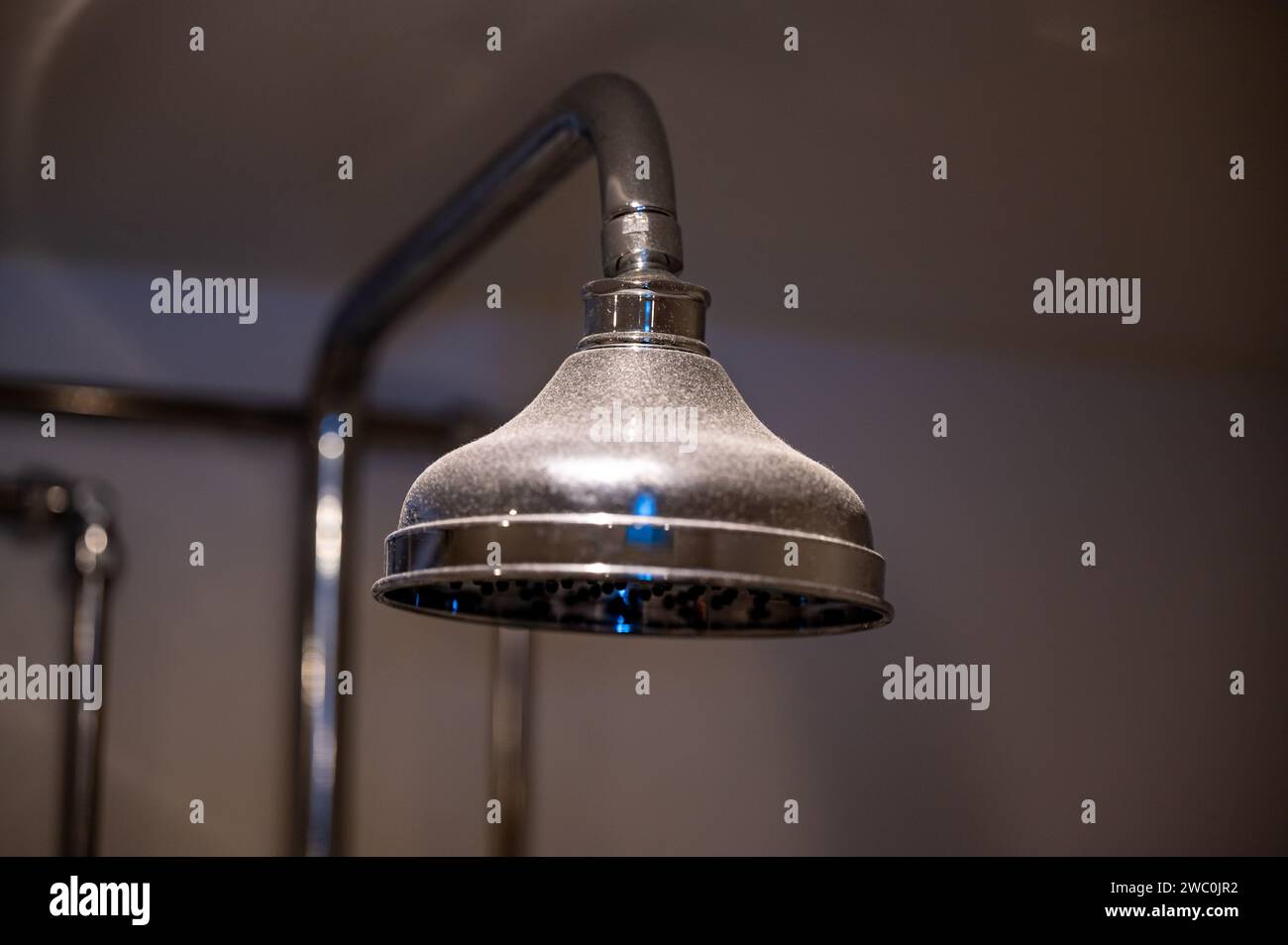 Chromium roof shower head covered in dust Stock Photo - Alamy