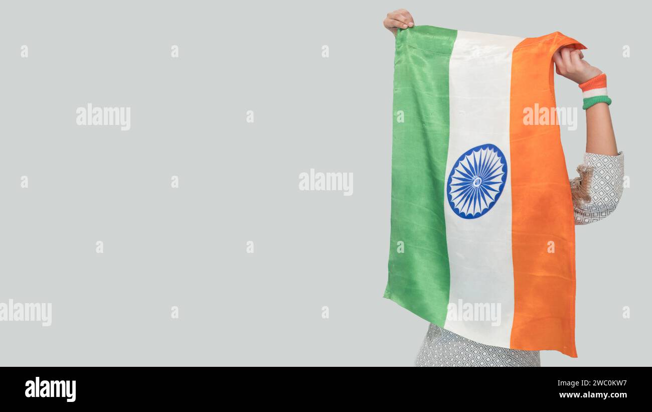 Backside view of an Indian teenage girl carrying a national flag on her ...