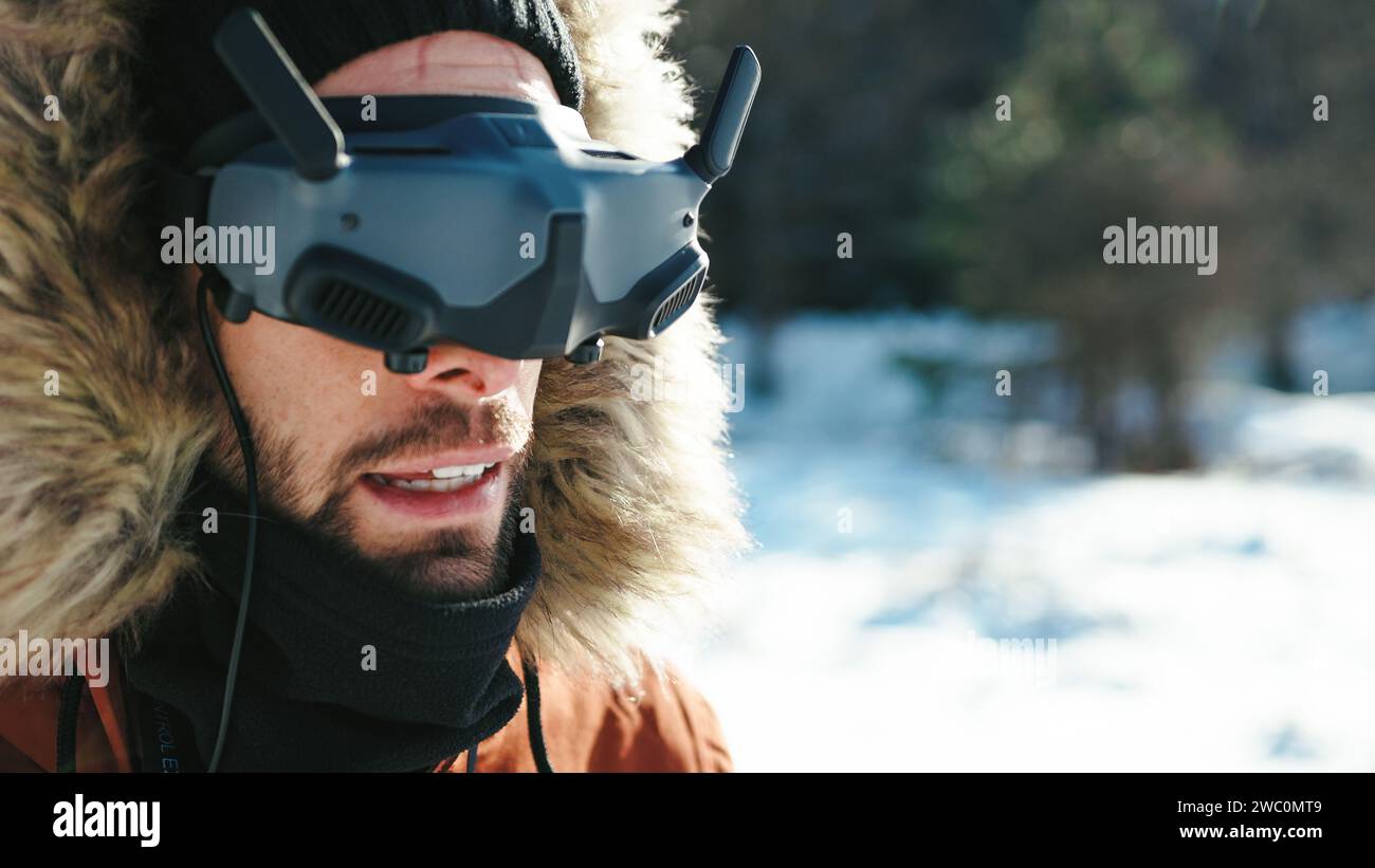 Fpv Drone pilot in the snow Stock Photo - Alamy
