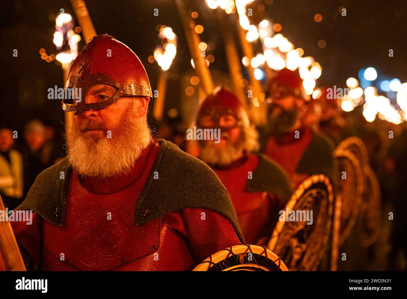 Guizer Jarl John Robert leads his squad with torches aflame through ...