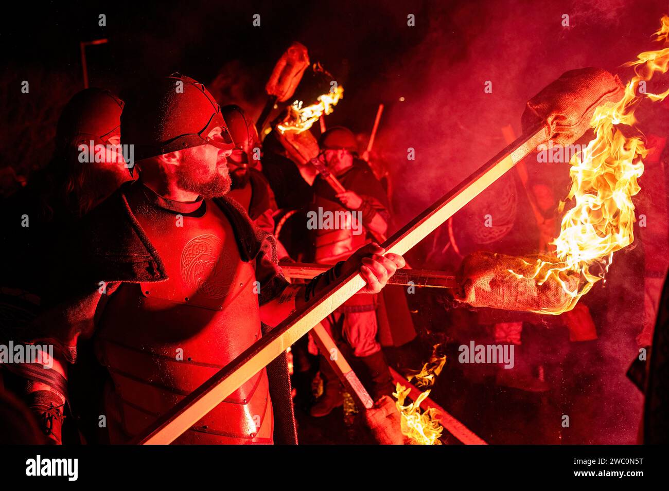 Guizer Jarl John Robert leads his squad with torches aflame through ...