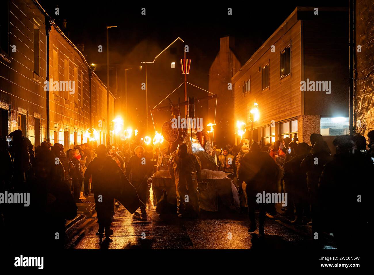 Guizer Jarl John Robert leads his squad with torches aflame through ...