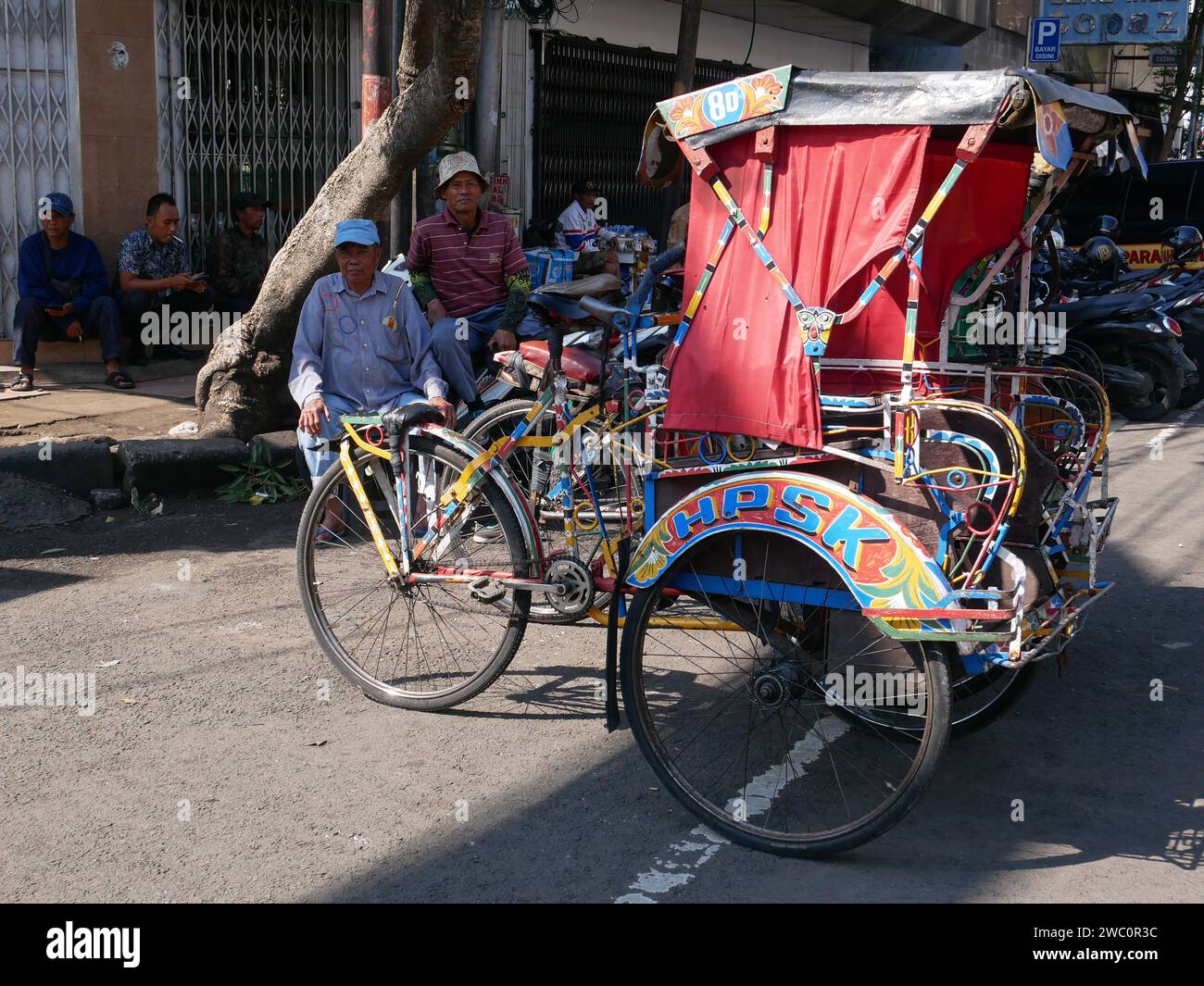 Pedicab or Becak on the roadside in Bandung, West Java, Indonesia Stock ...