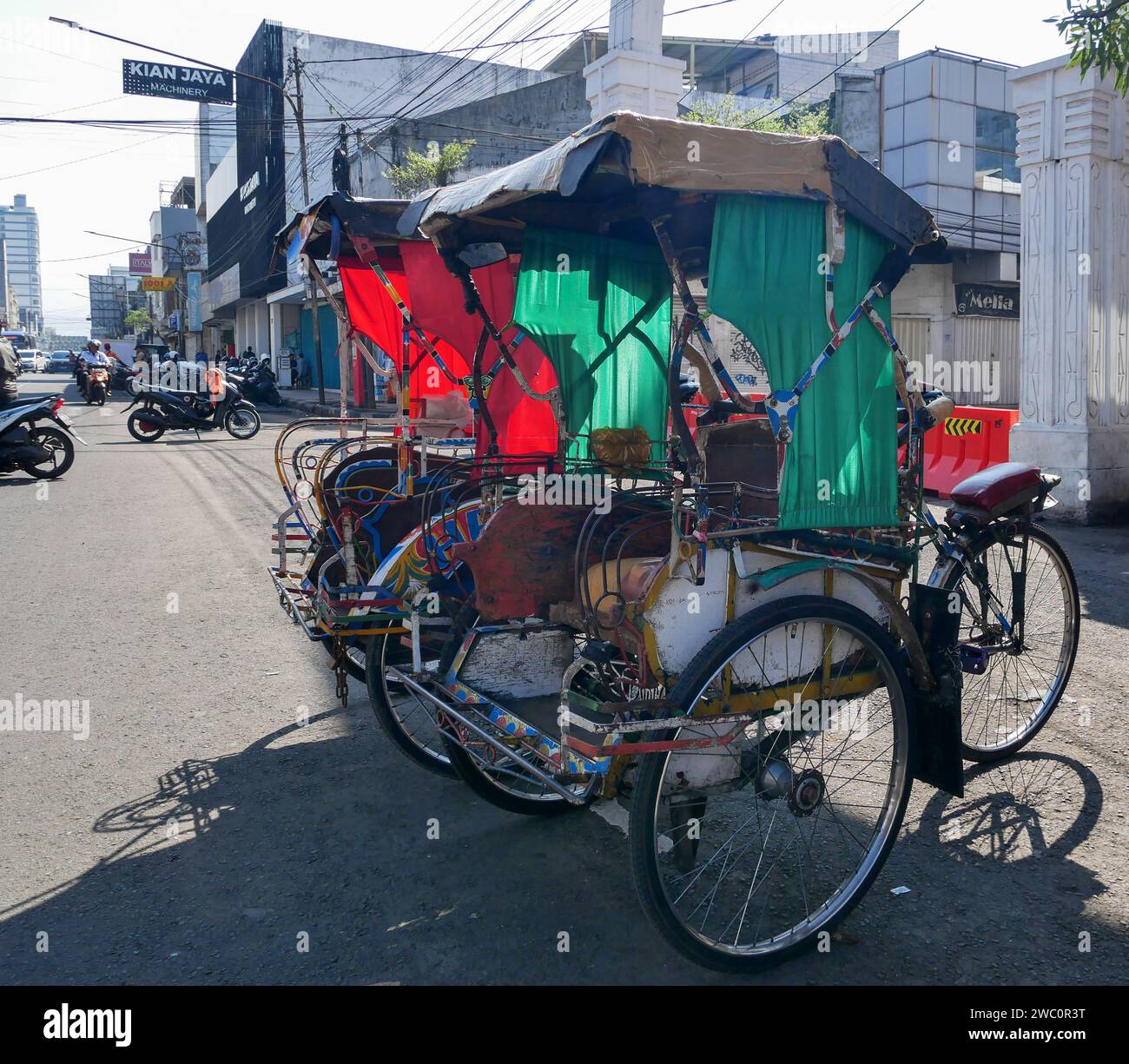 Pedicab or Becak on the roadside in Bandung, West Java, Indonesia Stock ...