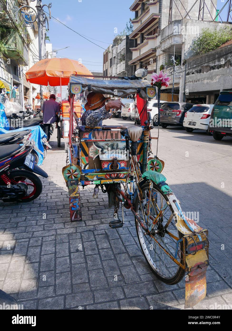 Pedicab or Becak on the roadside in Bandung, West Java, Indonesia Stock ...