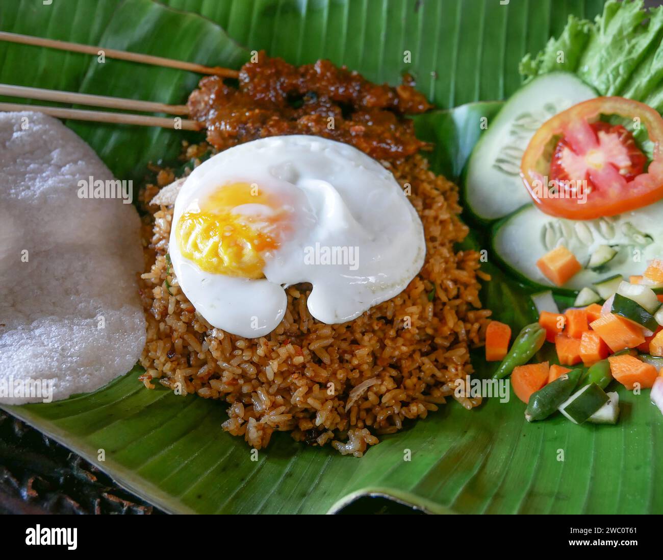 Fried Rice or Indonesian Nasi Goreng served on a banana leaf with ...