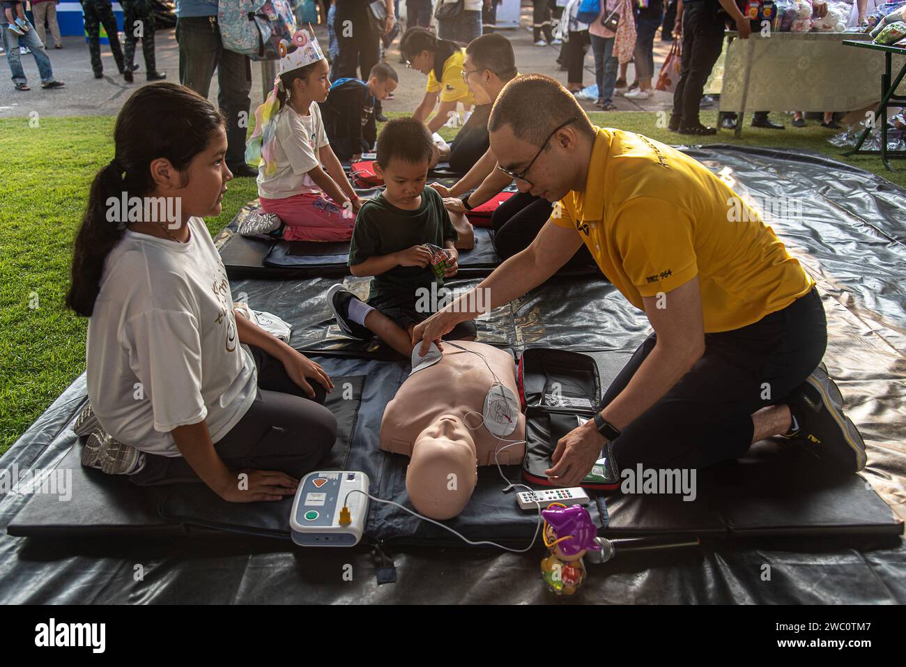 Bangkok, Thailand. 13th Jan, 2024. Army personnel teaching children for CPR during the Thailand ...