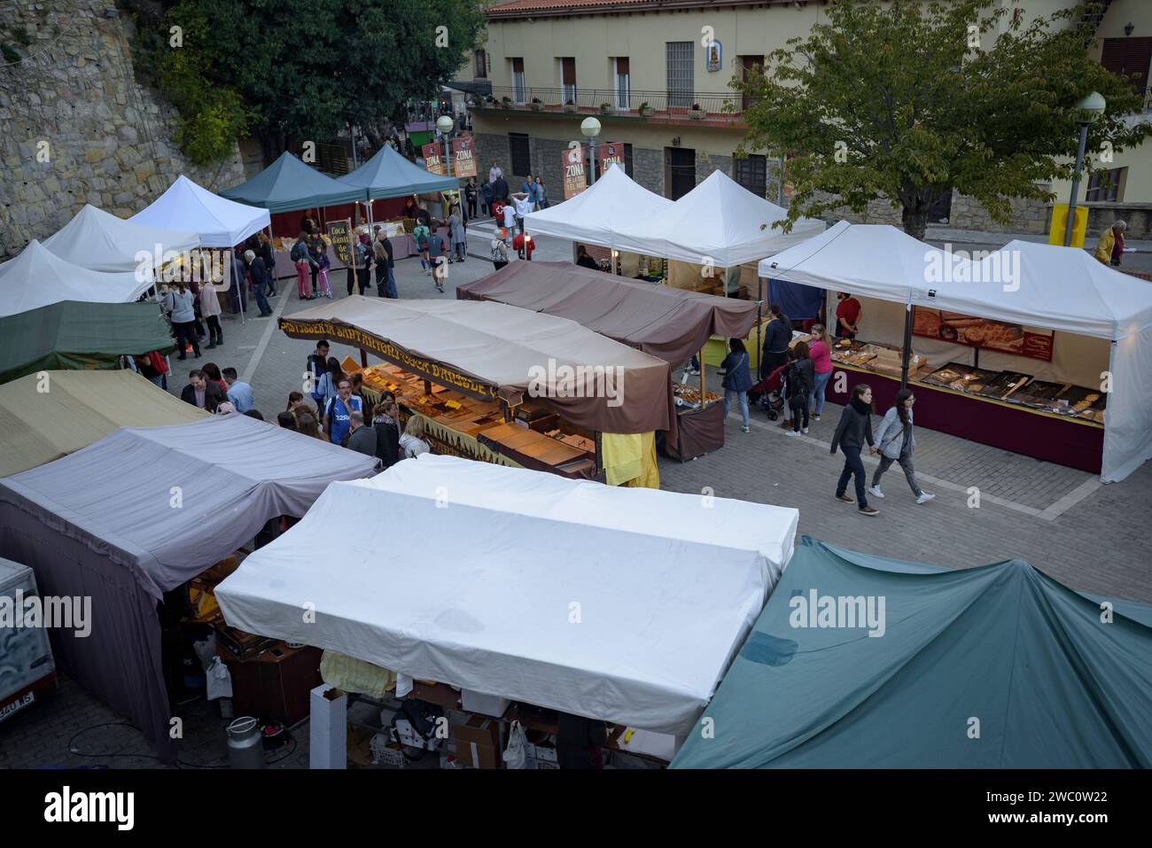 Traditional fair of coca (a typical catalan cake) and mató (a Catalan ...