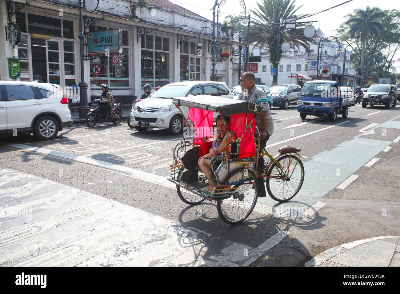 A Becak or Pedicab on Jl Asia Afrika in downtown Bandung, West Java ...