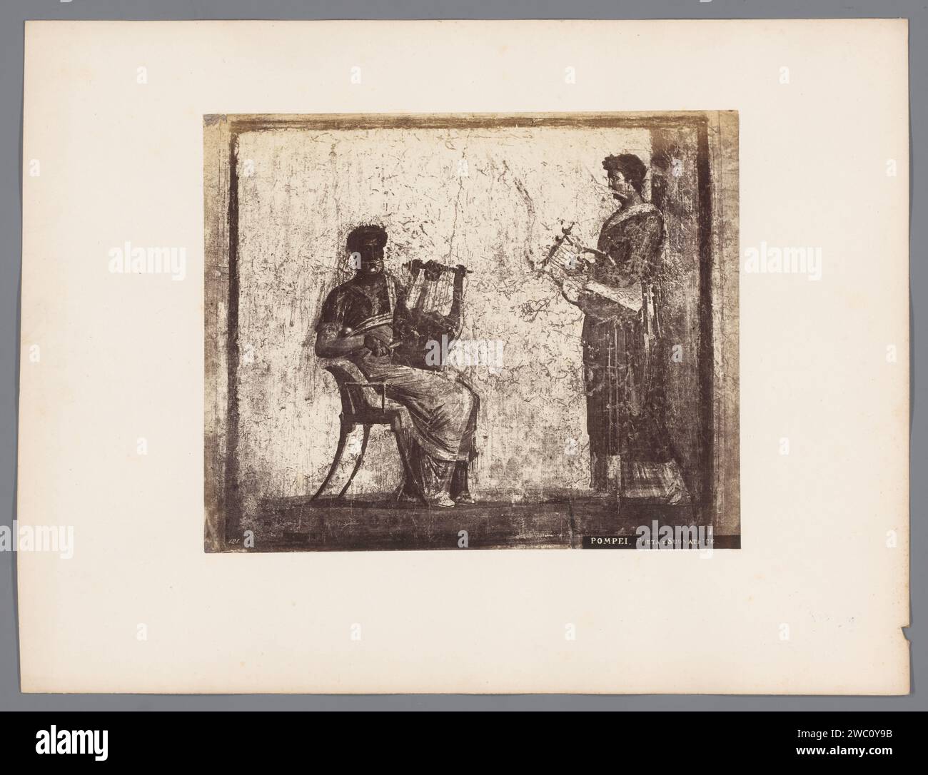 Photo production of a fresco representing two people playing on a winch ...