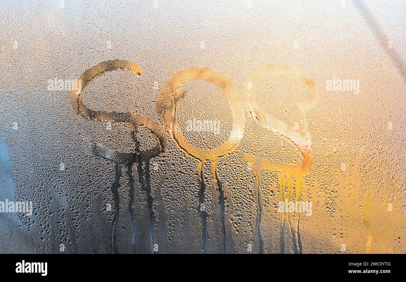 The word sos was written on the wet glass of the window Stock Photo - Alamy