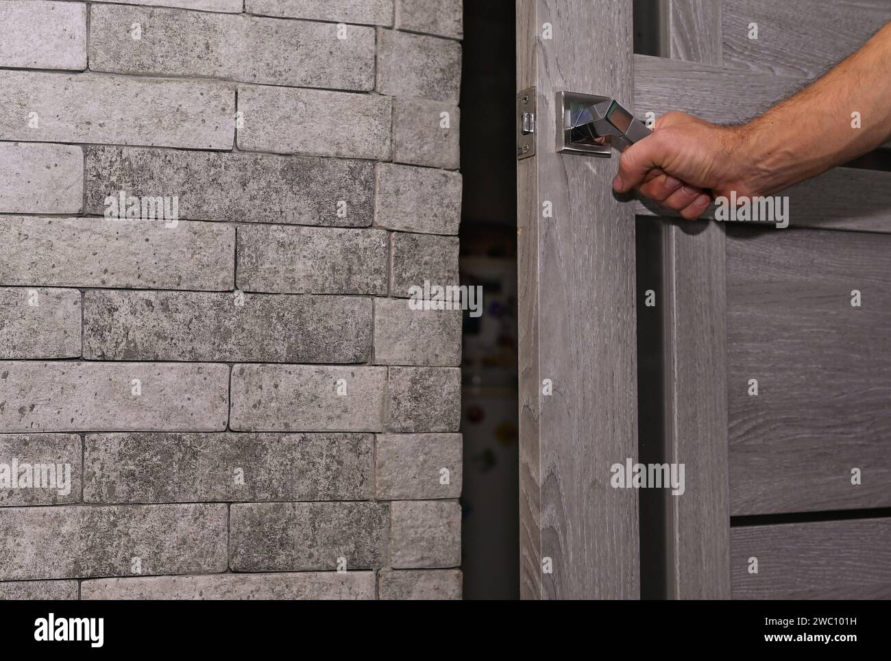 Women hand opens wooden door hi-res stock photography and images - Alamy