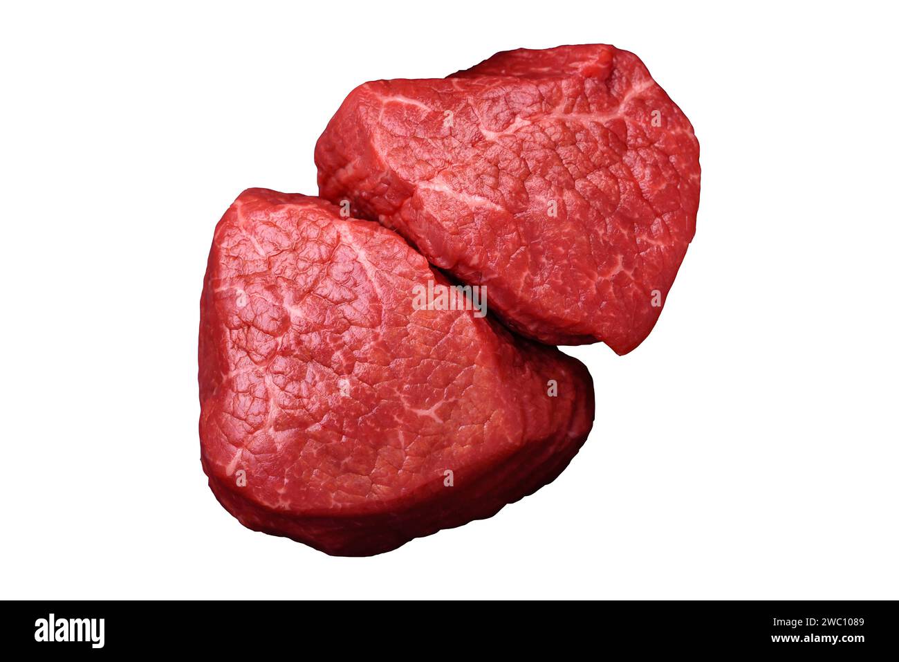 Fresh juicy raw beef medallions with salt and spices on a dark concrete ...