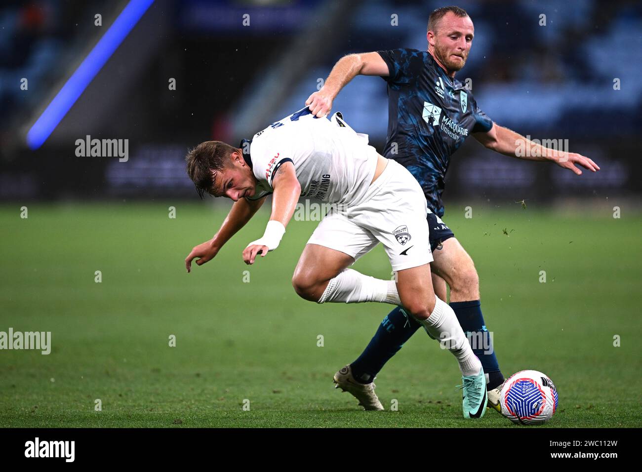 Sydney, Australia. 13th Jan, 2024. Luka Jovanovic of United is tackled ...