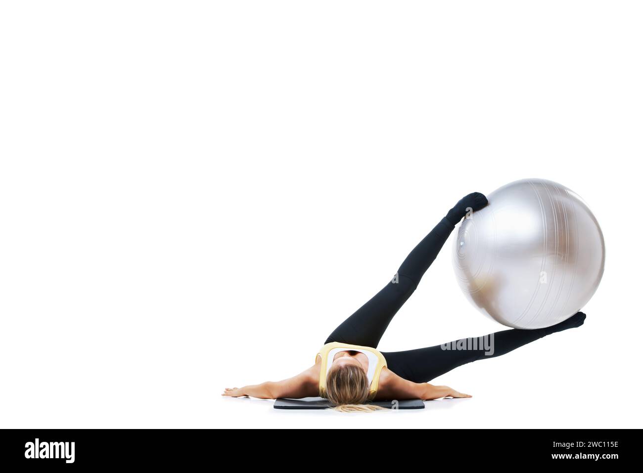 Woman, legs and exercise ball for workout or health and wellness on a ...