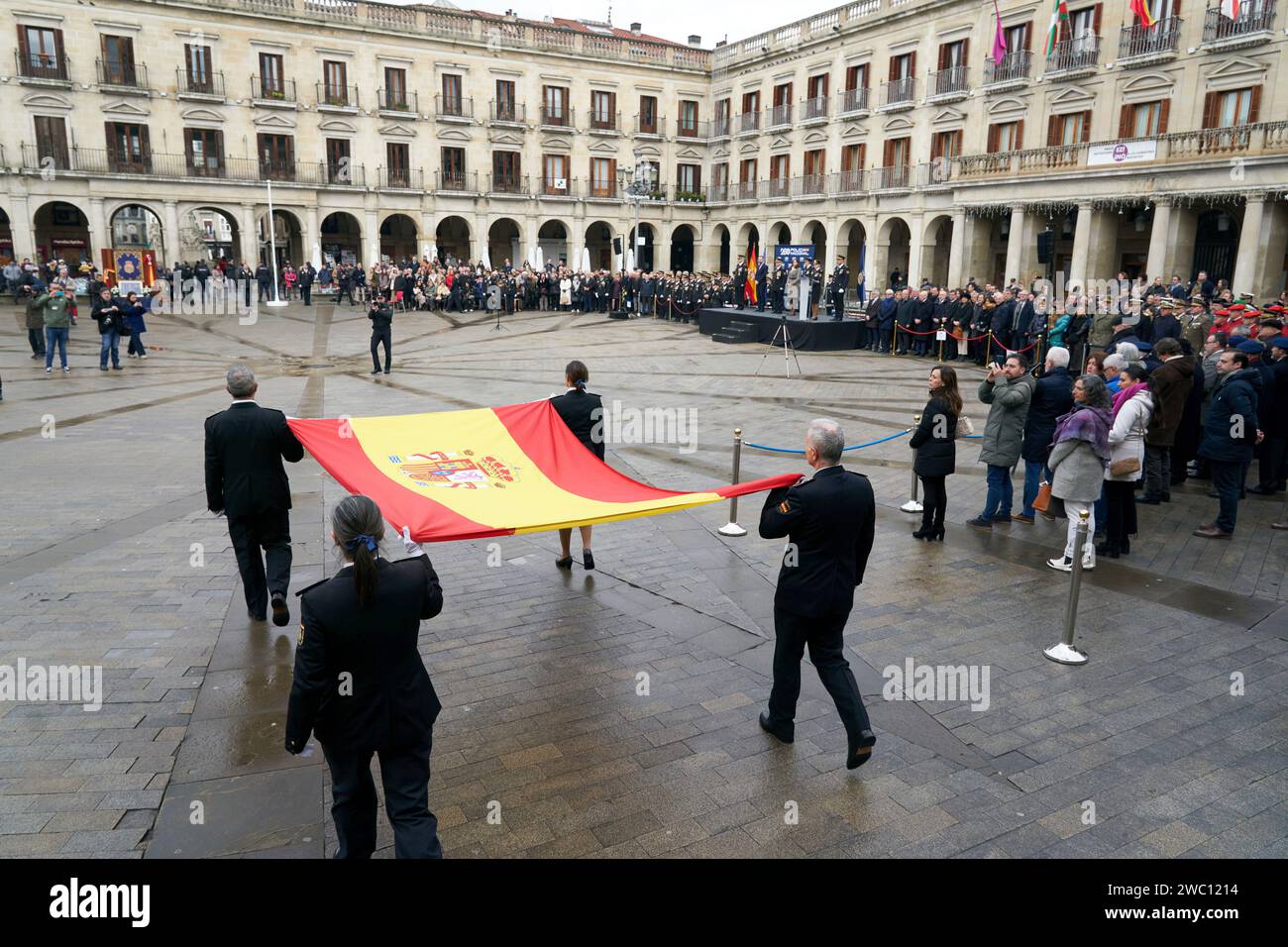 Four officers carry the flag of Spain during the celebration of the ...