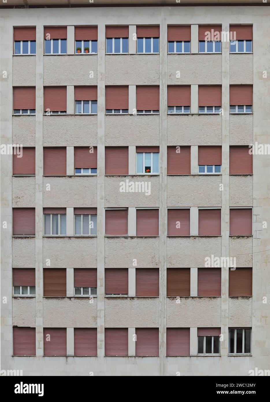 modern building with forty-eight shuttered windows with apartments and ...