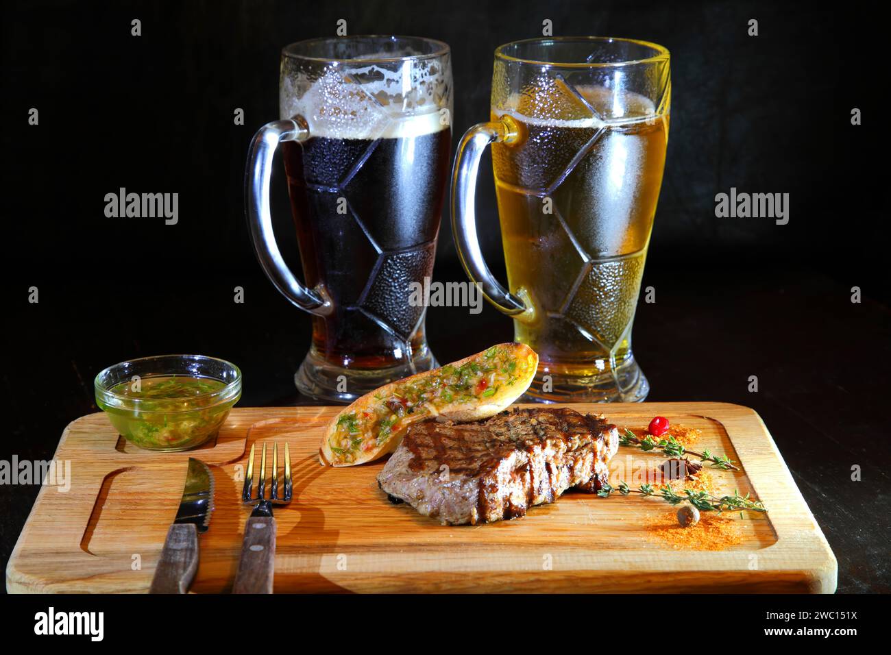 Steak and beer. Tasty steak. Dark and light beers for steak Stock Photo ...