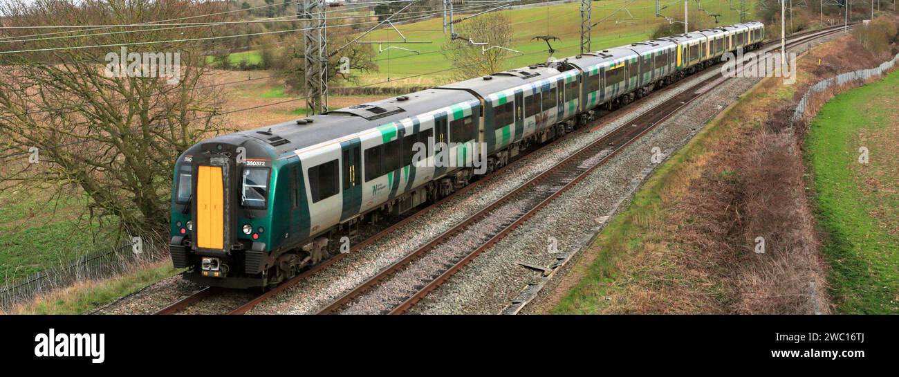London Northwestern 350 class train near Blisworth village, Northamptonshire, England. On the ...