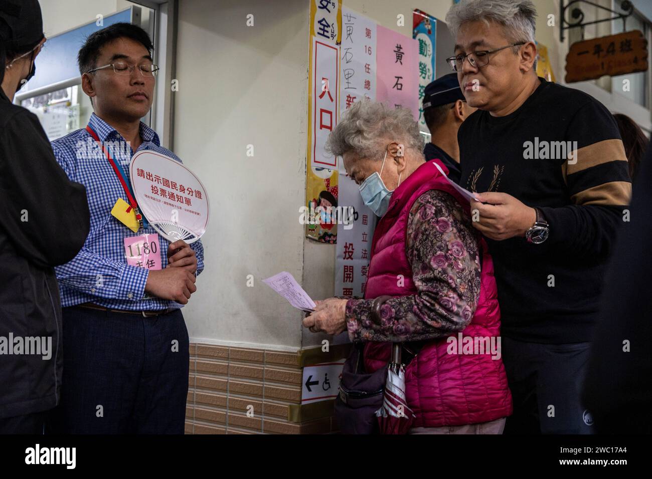 People were lining to vote at the polling station in Banqiao District ...