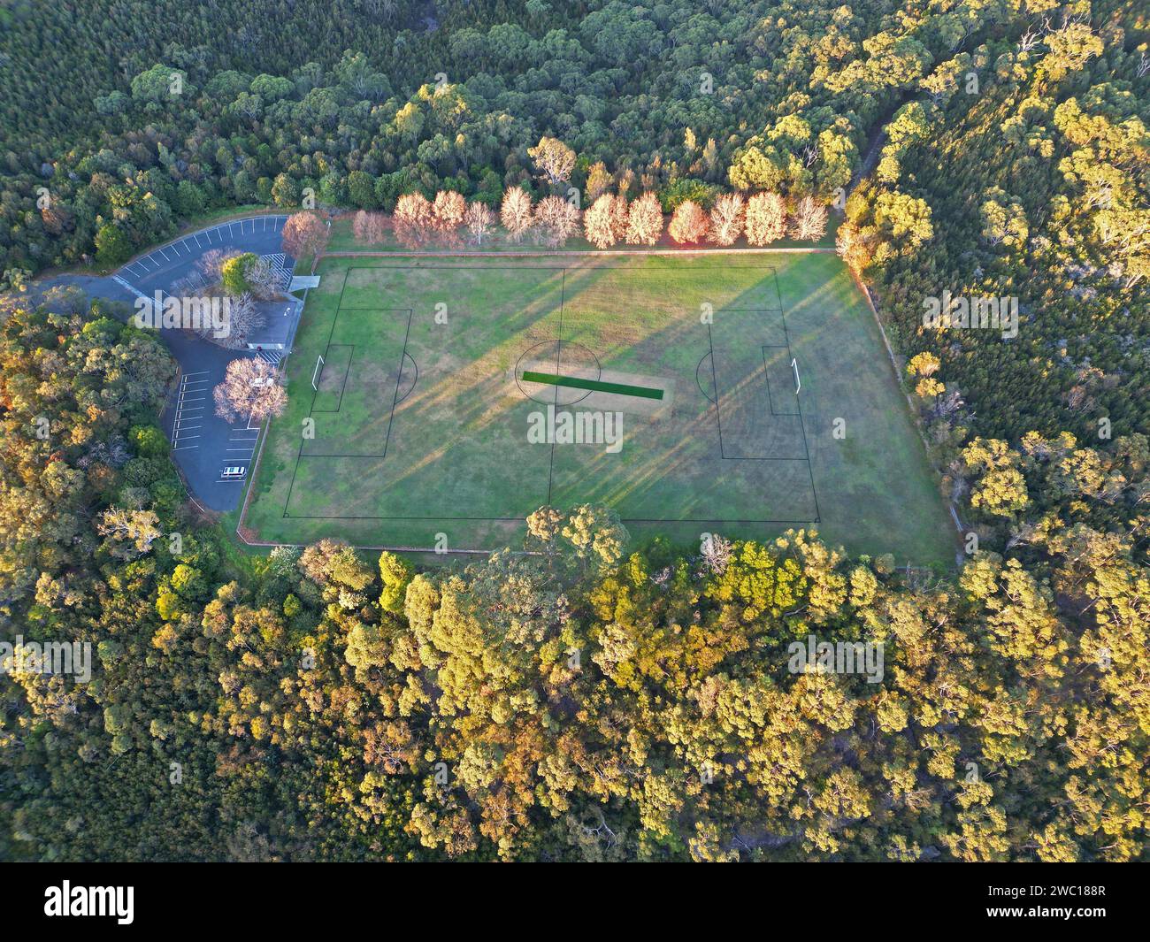 An aerial view of sunrise at a green football field at Wahroonga, NSW ...