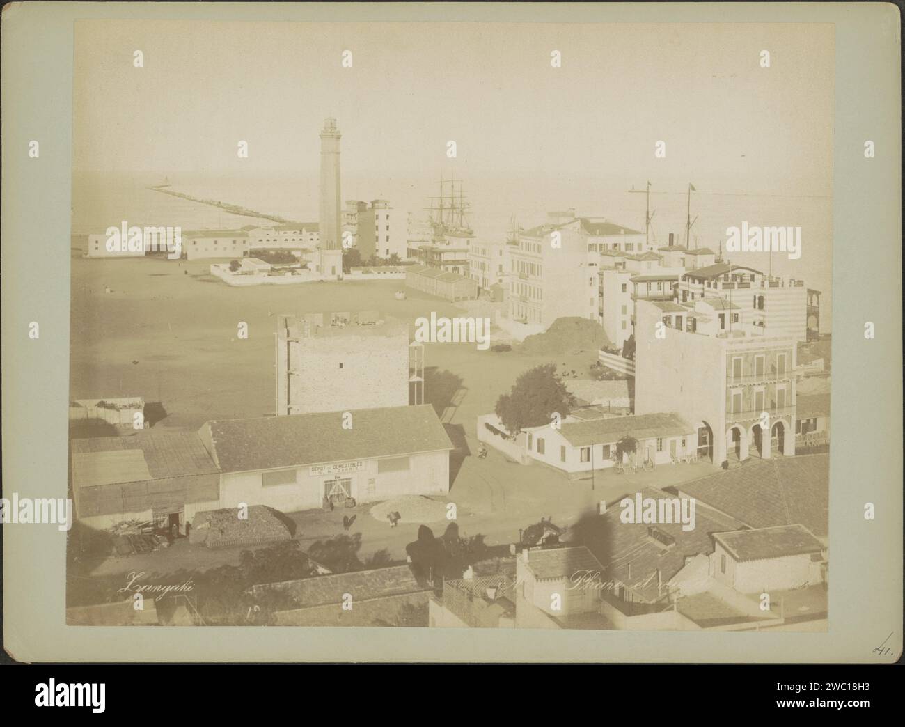 View of buildings, the lighthouse and the entrance of the Suez Canal at ...