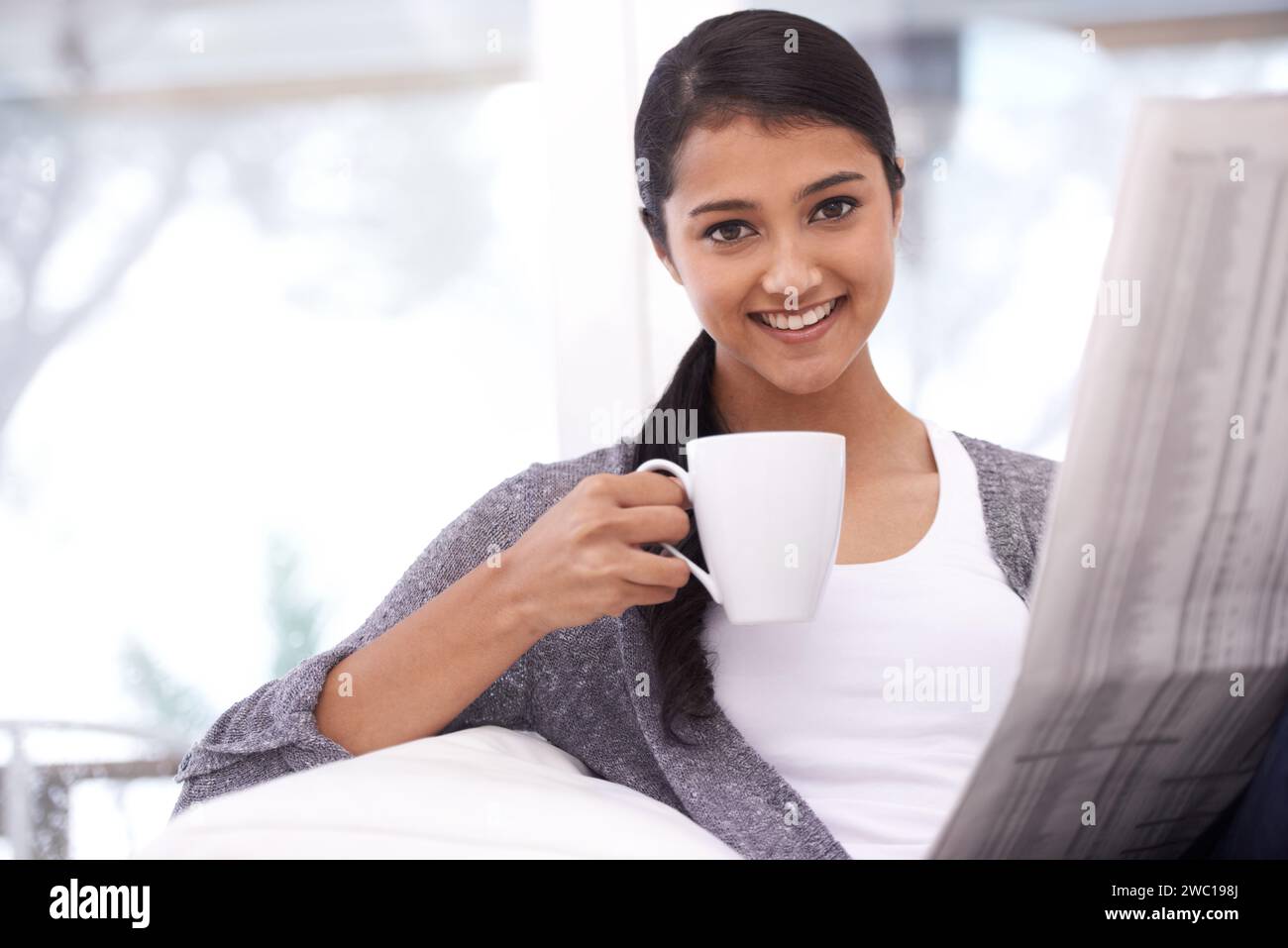 Woman, portrait and newspaper in a home in the morning with story ...