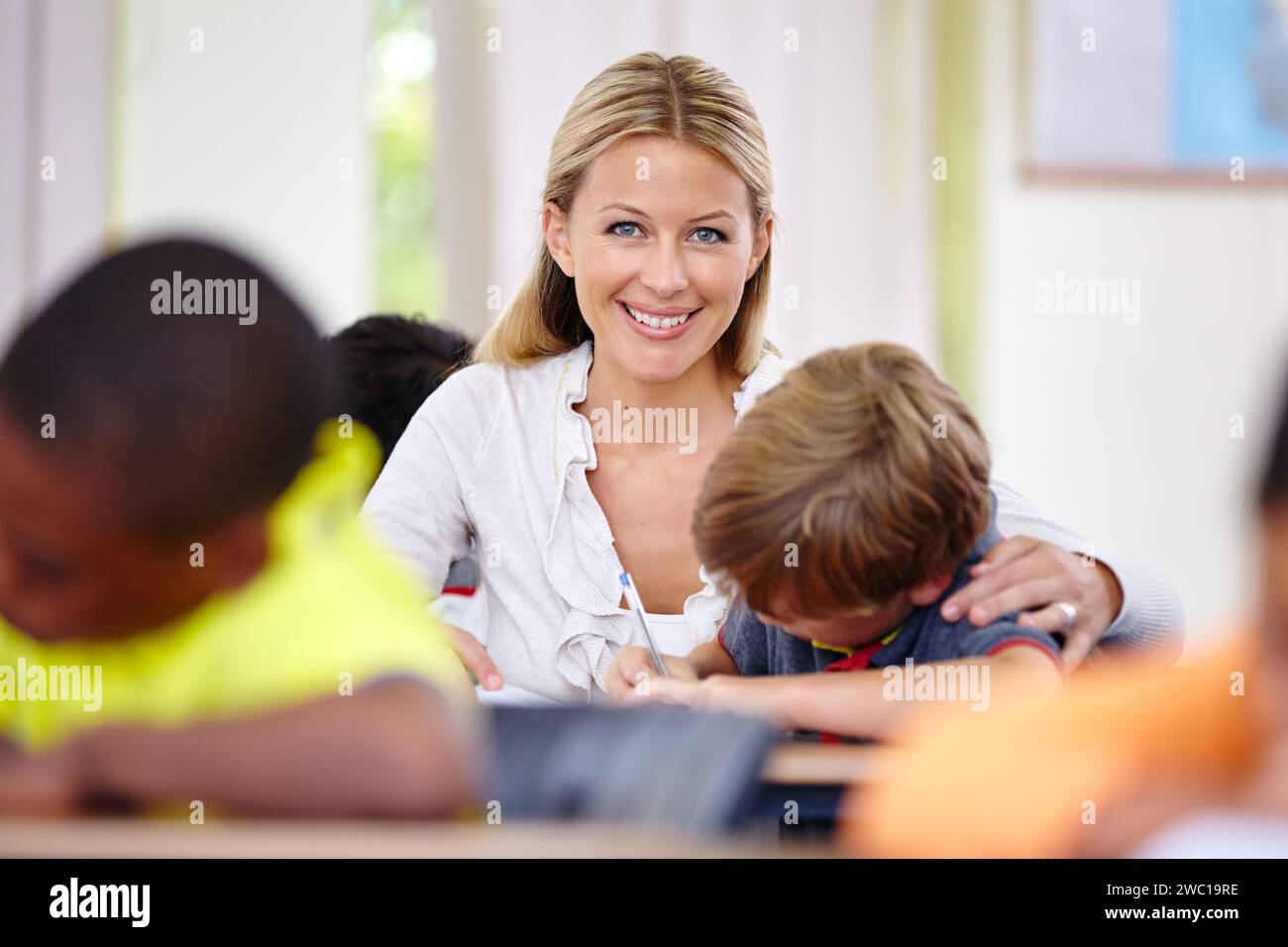 Portrait of happy teacher, kid or writing in classroom for learning ...