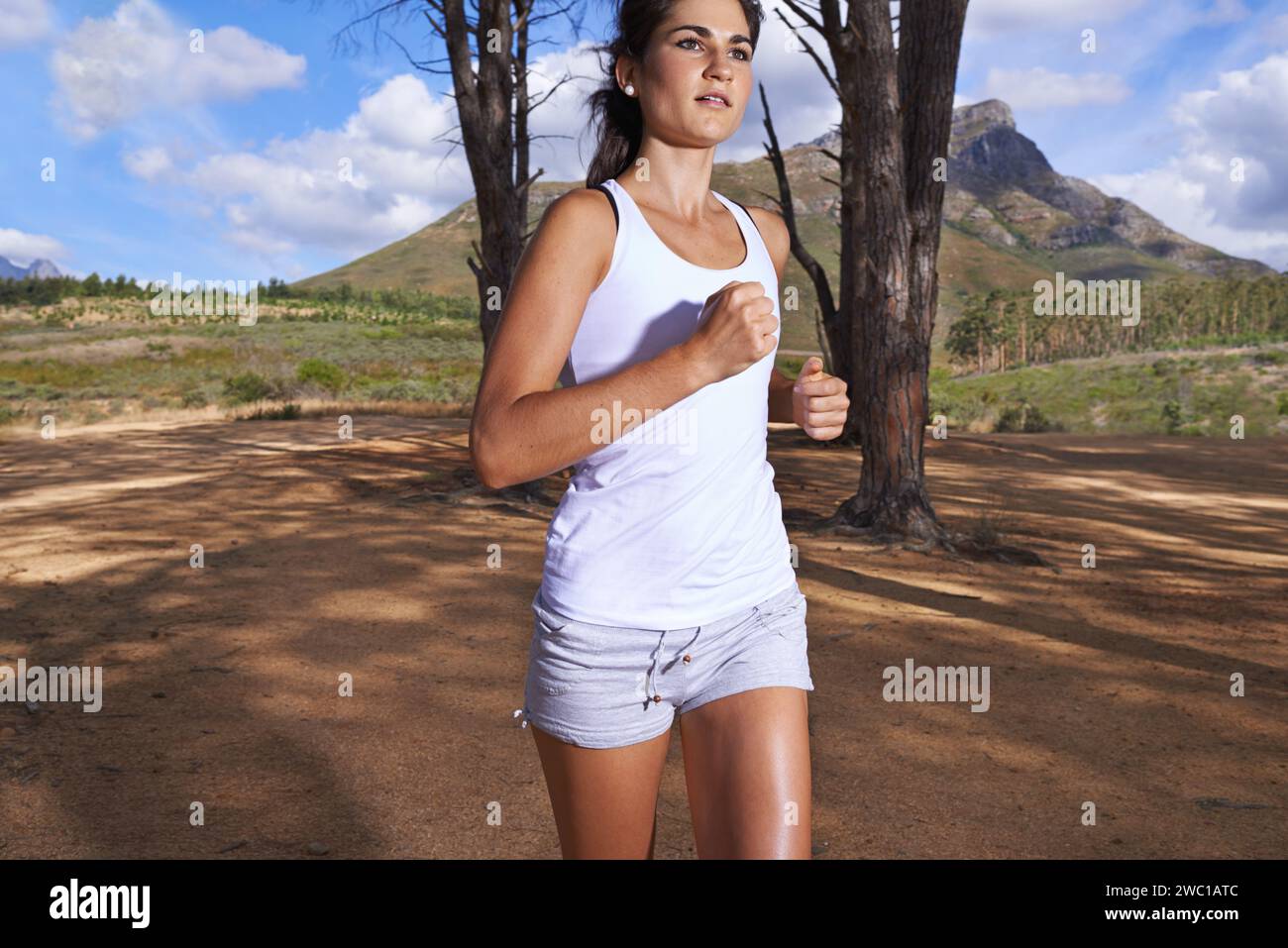 Woman, run in forest and fitness with cardio for health, wellness and ...