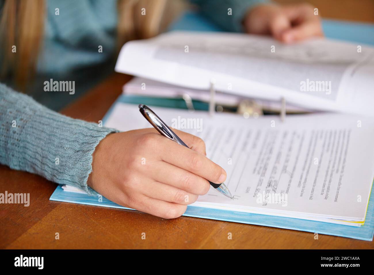 Student checking paper teacher hi-res stock photography and images - Alamy