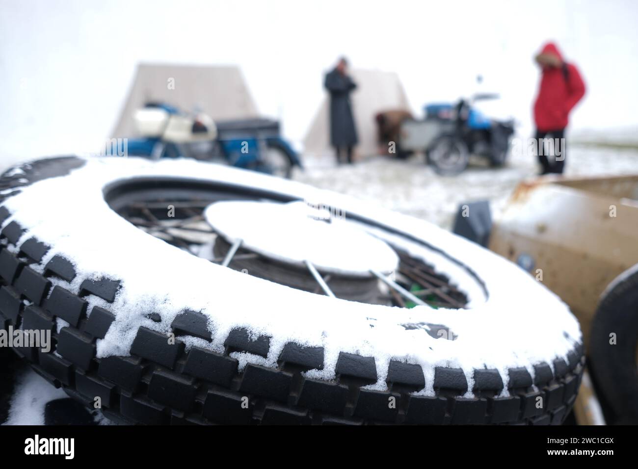 Augustusburg, Germany. 13th Jan, 2024. A snow-covered spare wheel at ...