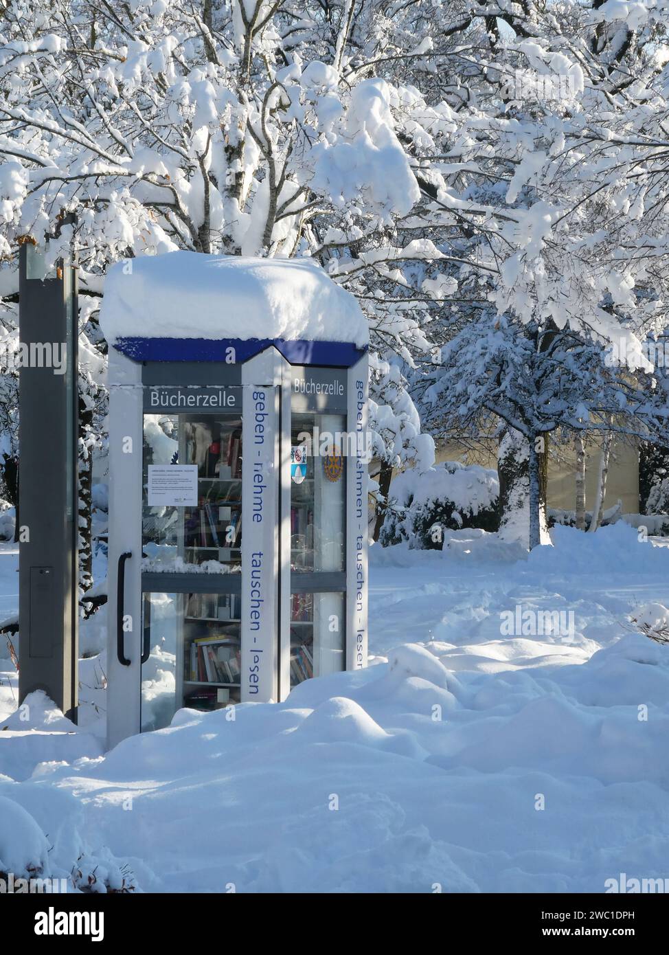 Garching, Bavaria, Germany - January 2024, public book booth to borrow ...