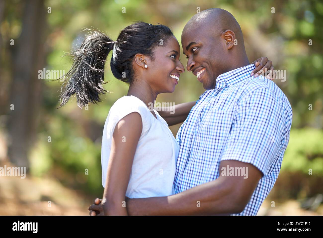 Hug, love or happy black couple in nature to relax or bond on holiday ...