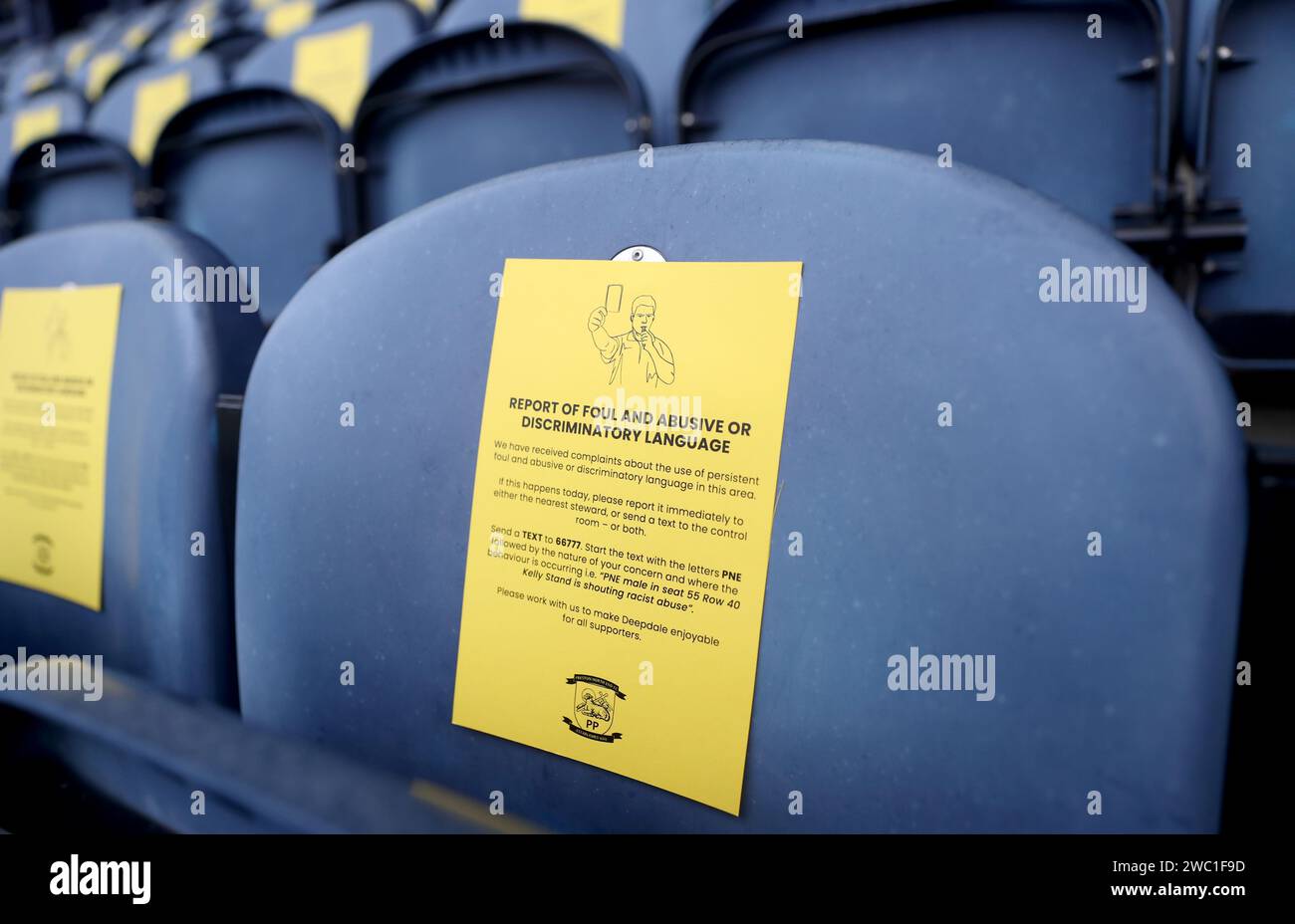 A general view of a sign on the back of a seat in the stadium ...