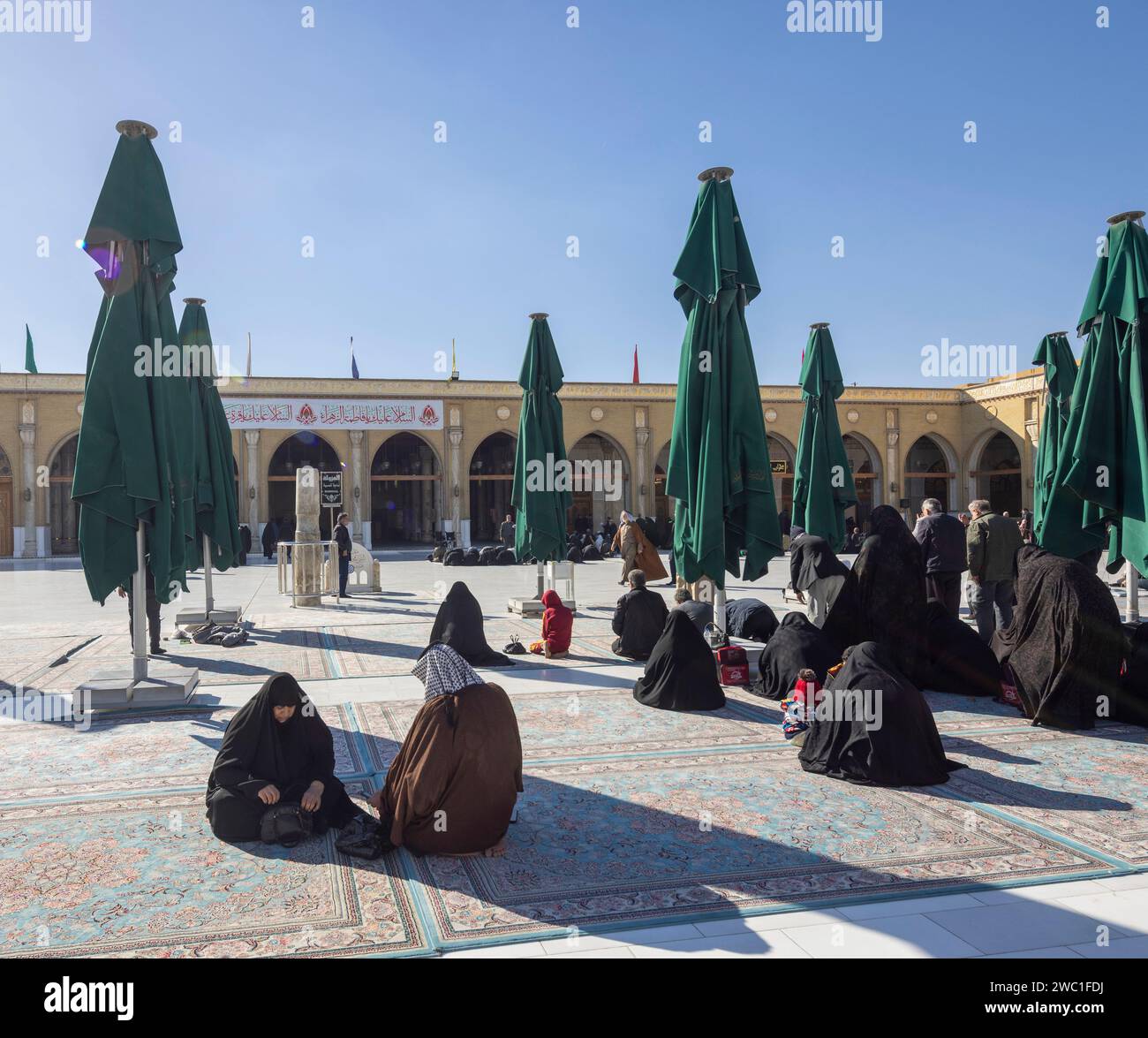 pilgrims in the courtyard of the Great Mosque of Kufa, Iraq Stock Photo ...