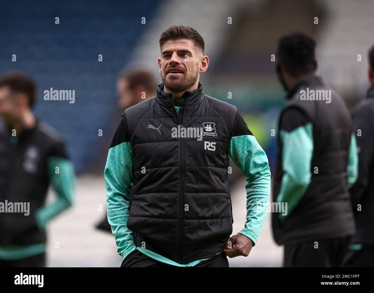 Joe Edwards of Plymouth Argyle walks on and inspect the pitch during ...
