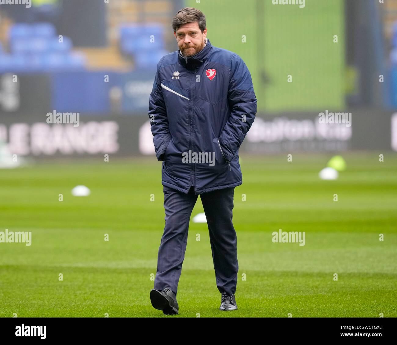 Darrell Clarke manager of Cheltenham Town inspects the pitch before the ...